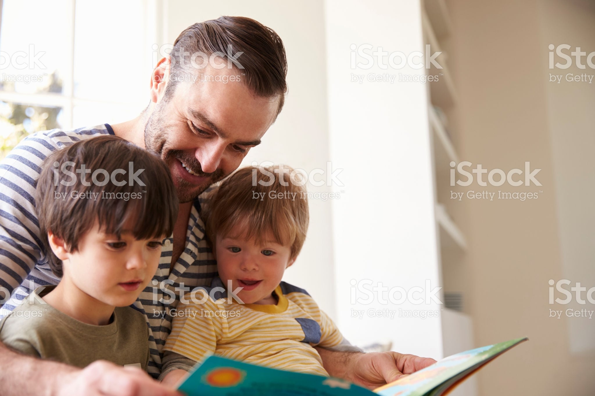 father-reading-children | Family Support Center | Barry County, MI